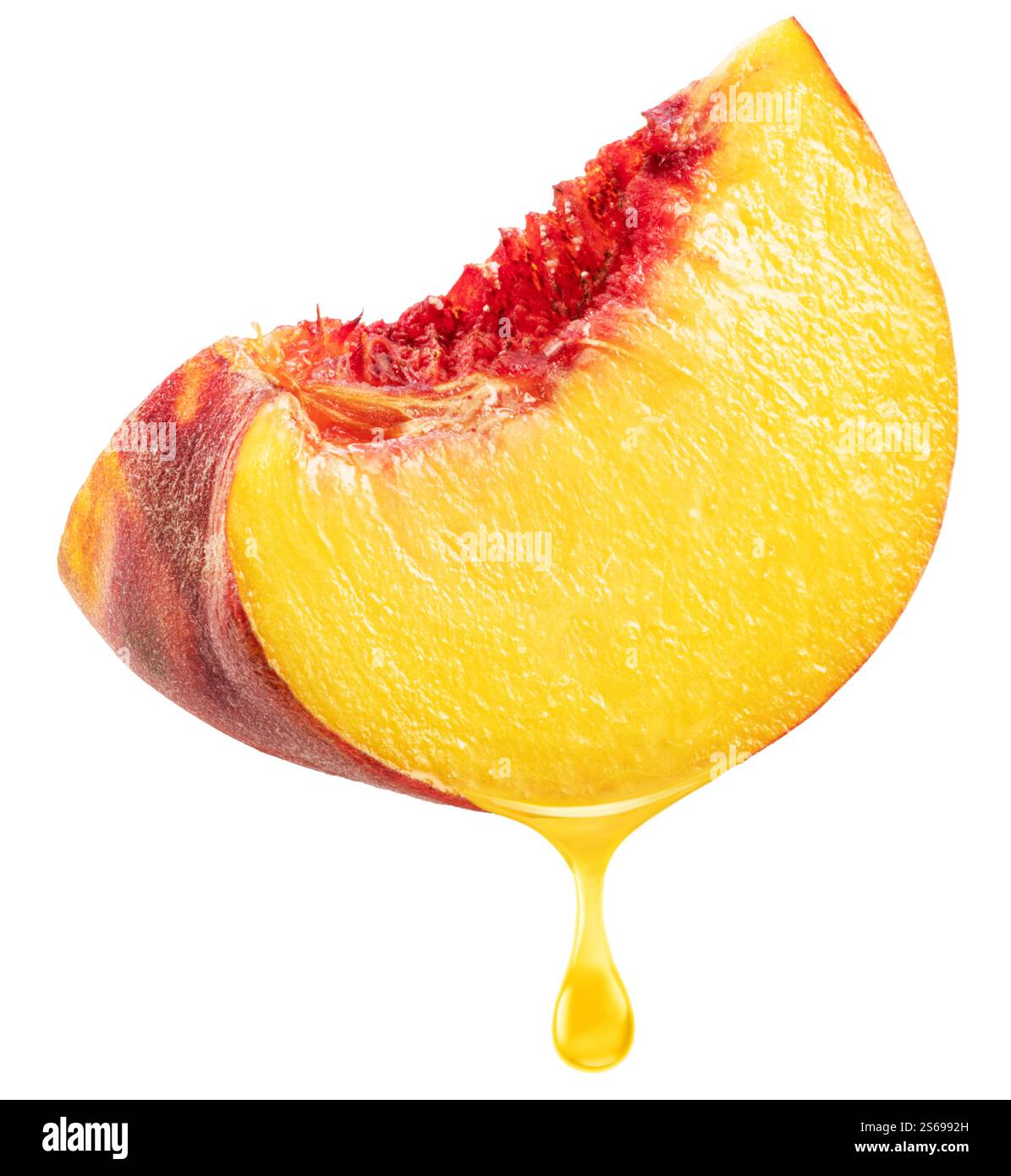 Slice of peach fruit and peach juice dripping from it on a white ...