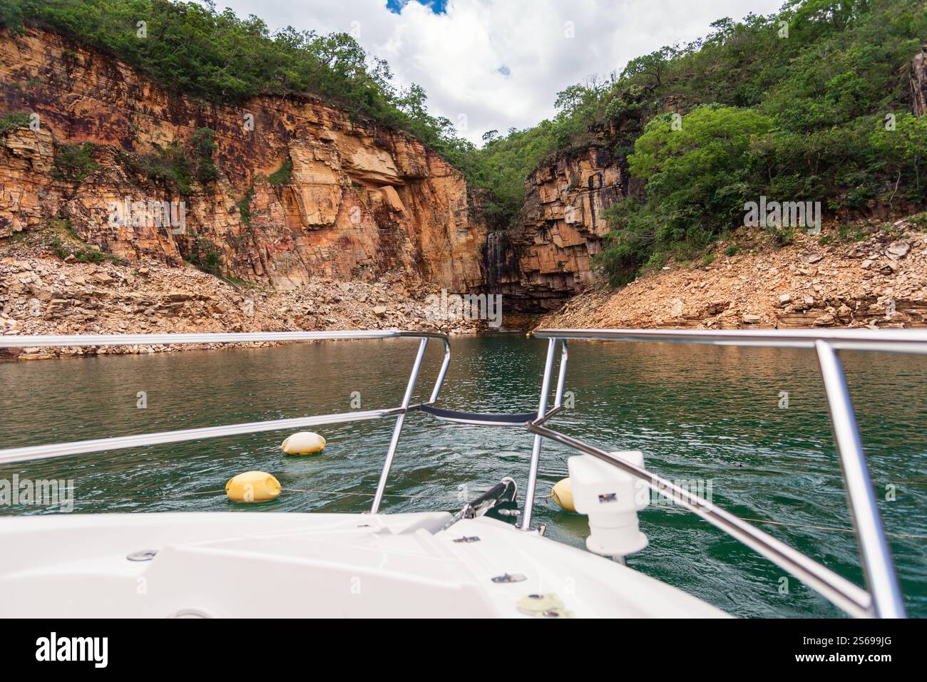 View from a boat of a waterfall at Furnas Dam Lake in Capitólio, Minas ...