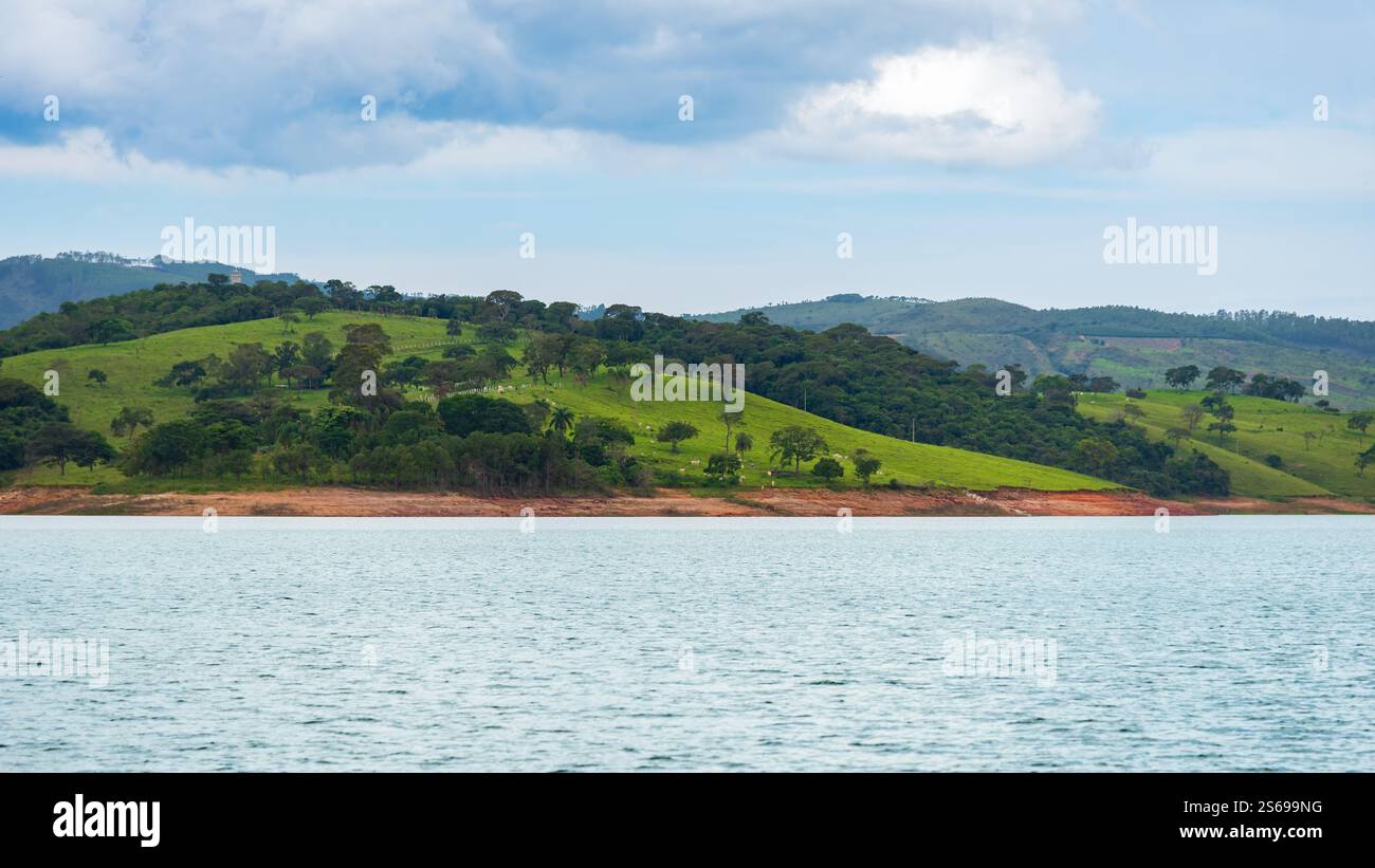 Landscape view of farmland by the Furnas Dam Lake in Capitólio, Minas ...