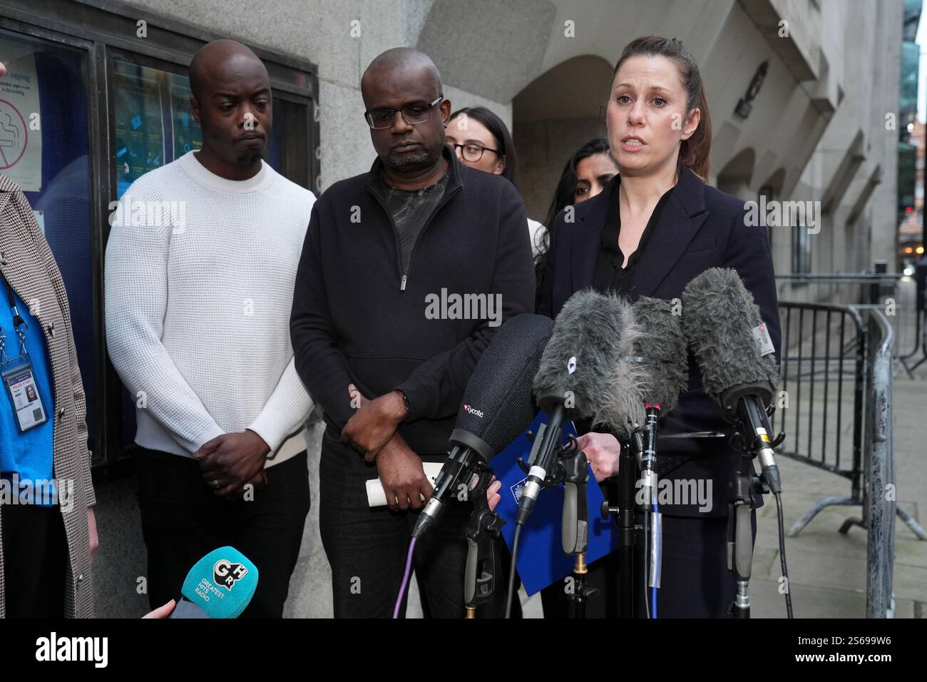 Michael Andam (centre), the father of Elianne Andam is accompanied by ...