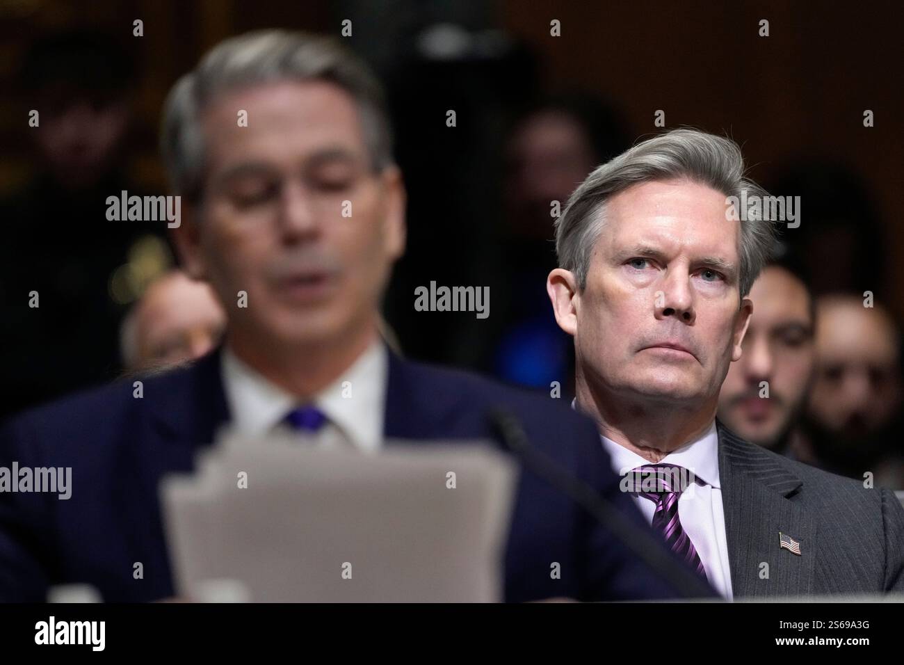 John Freeman, right, listens to his husband Scott Bessent, left ...