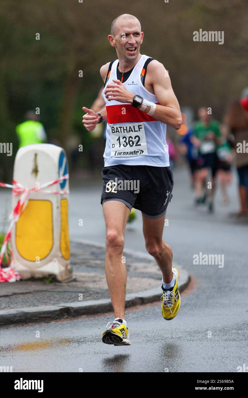 Male athletes running and competing in the Bath Half Marathon road race ...
