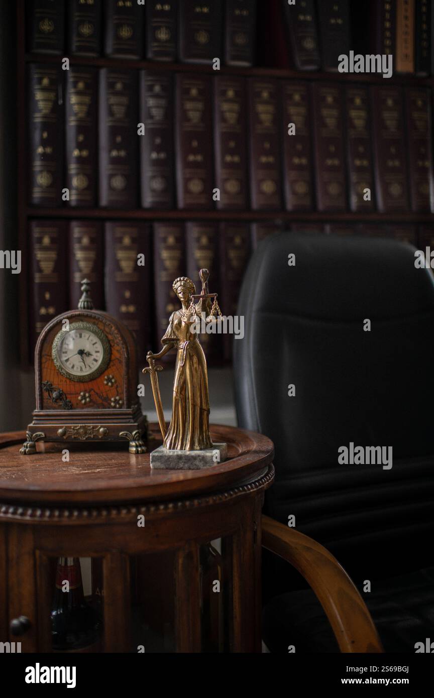 A lawyer’s office with bookshelves, antique clocks, and a Lady Justice ...