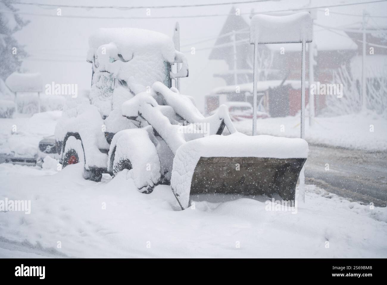 Snow blower stuck in snowdrift Stock Photo - Alamy