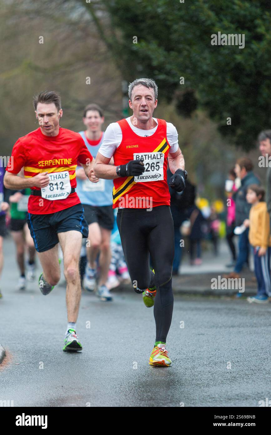 Male athletes running and competing in the Bath Half Marathon road race ...