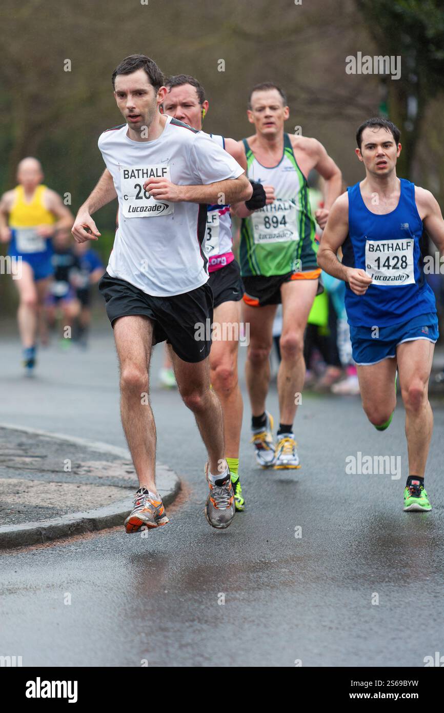 Male athletes running and competing in the Bath Half Marathon road race ...