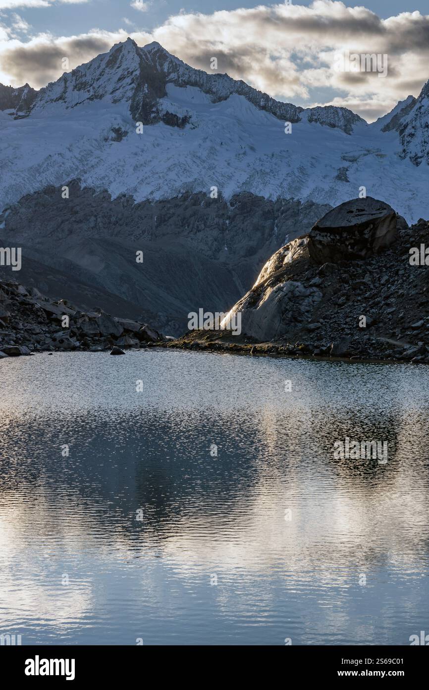 Mountain lake reflexion. The beautiful lake is between alpine meadows ...