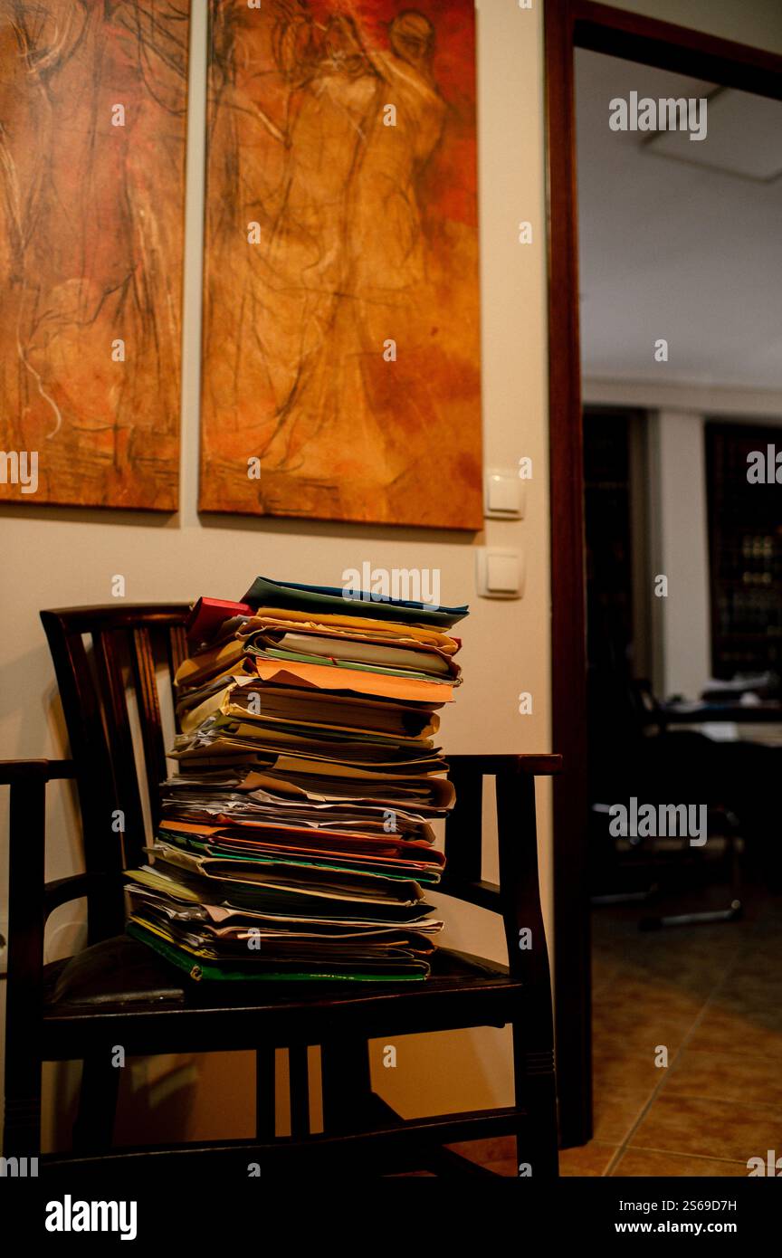 A lawyer’s office with bookshelves, antique clocks, and a Lady Justice ...