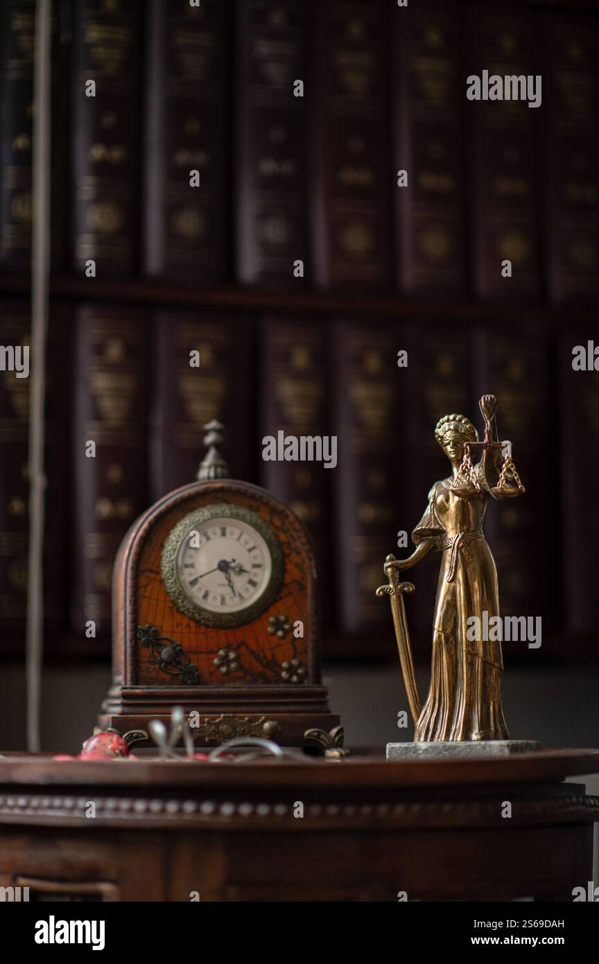 A lawyer’s office with bookshelves, antique clocks, and a Lady Justice ...