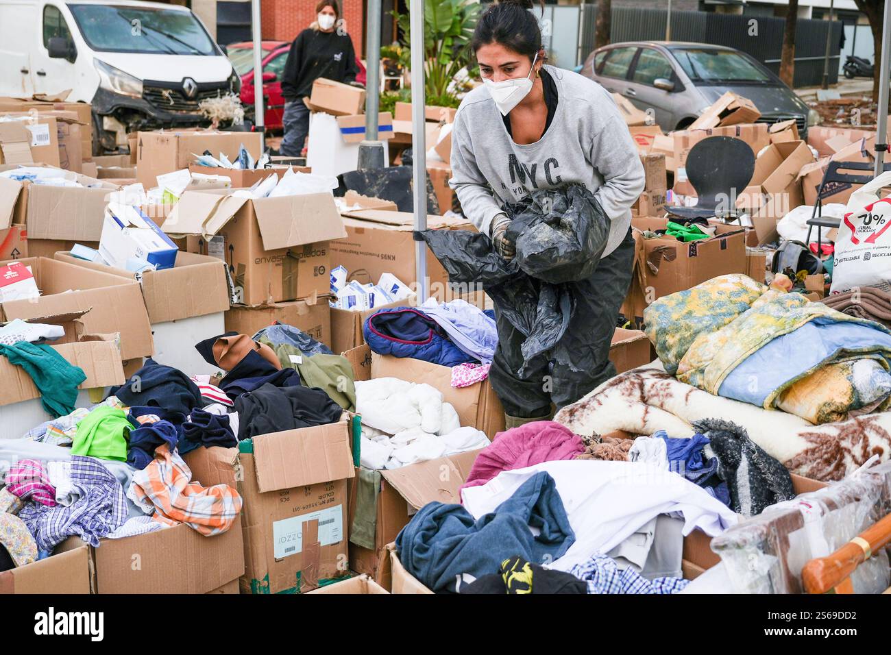Woman wearing surgical mask, personal protective equipment, organizing ...