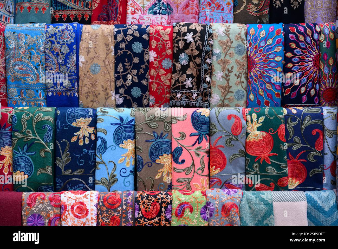 Palette of colors and patterns of national Uzbek fabrics in Samarkand ...