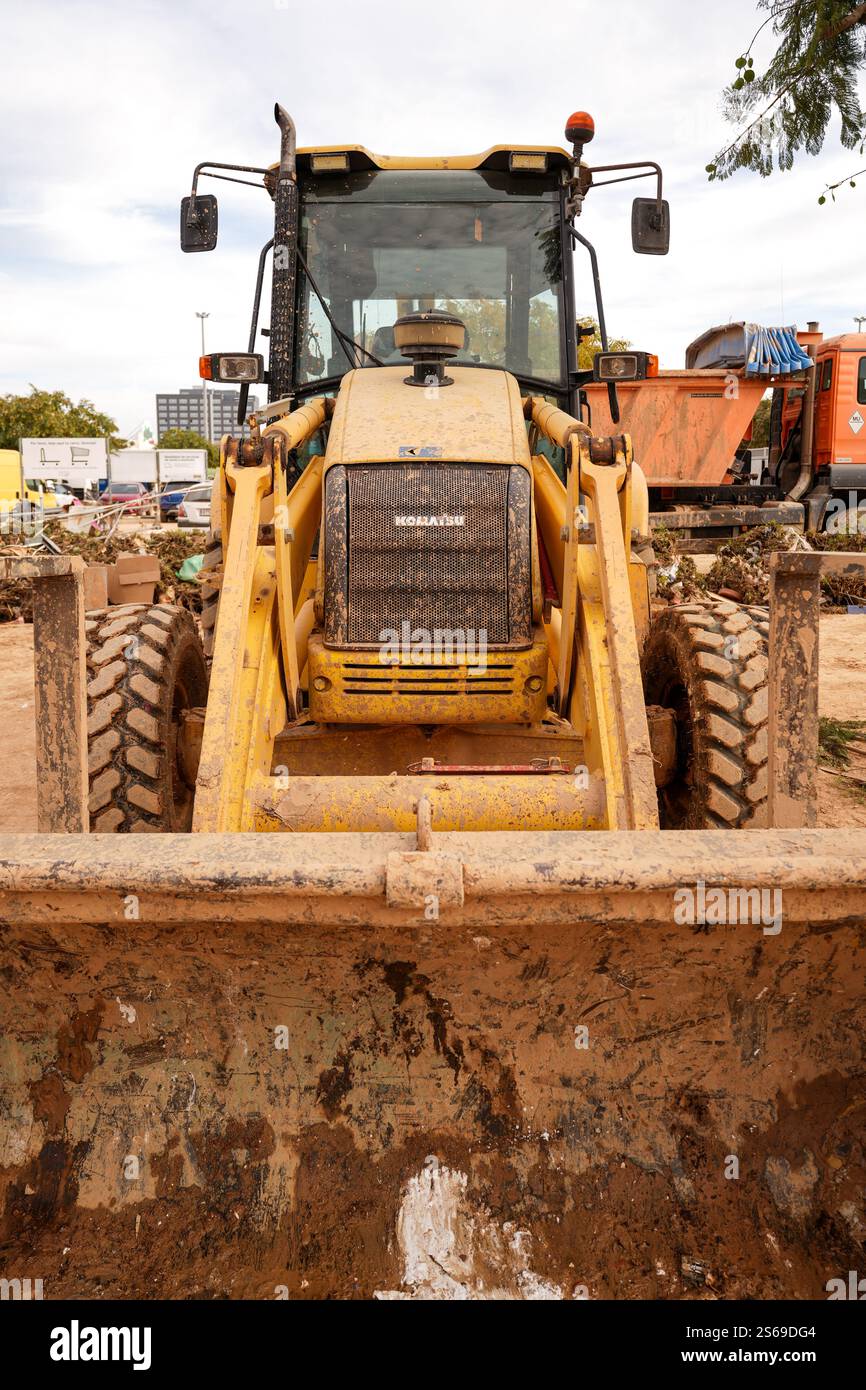 Frontal view of excavator covered in mud and dirt in the logistic point ...