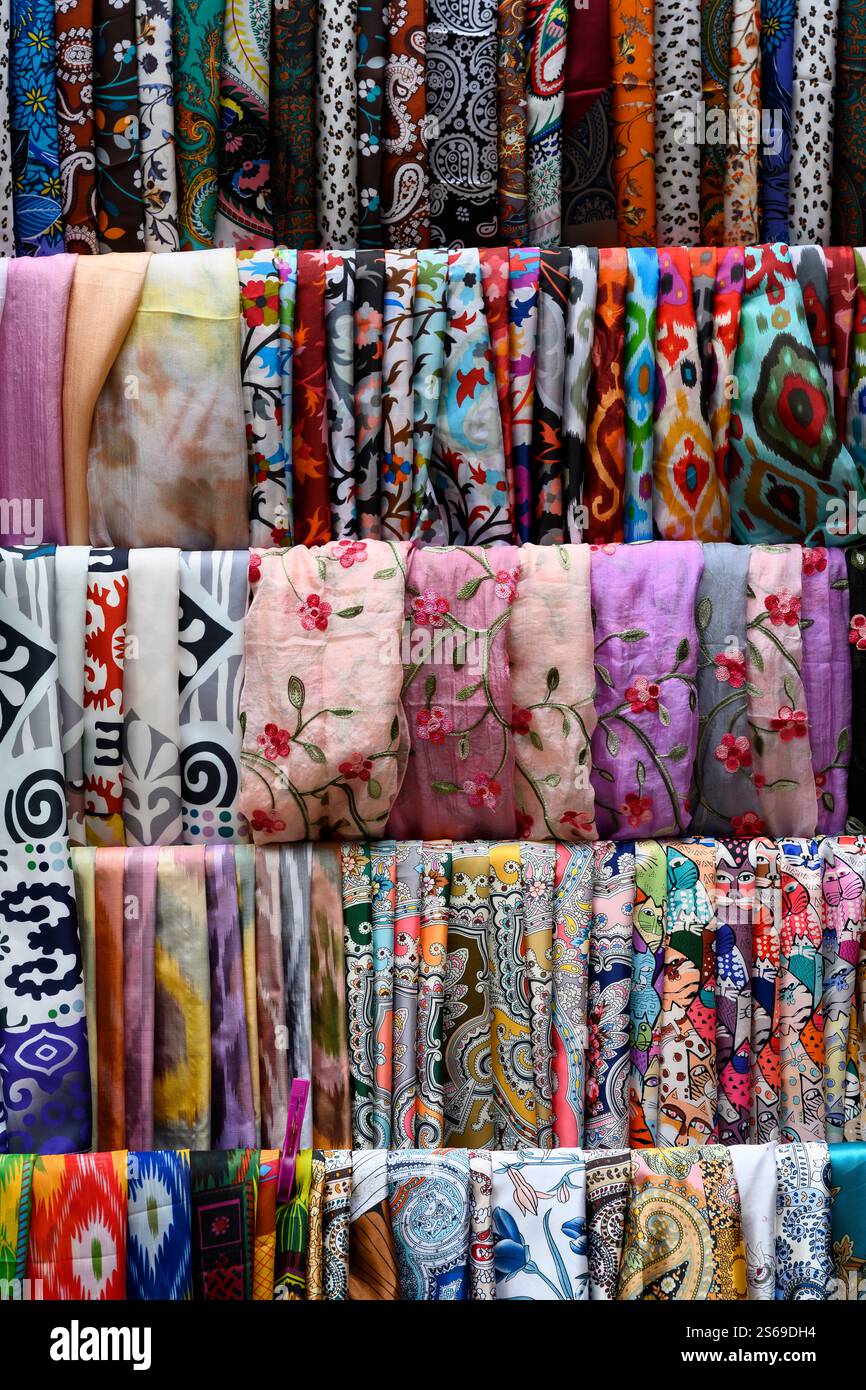 Palette of colors and patterns of national Uzbek fabrics in Samarkand ...