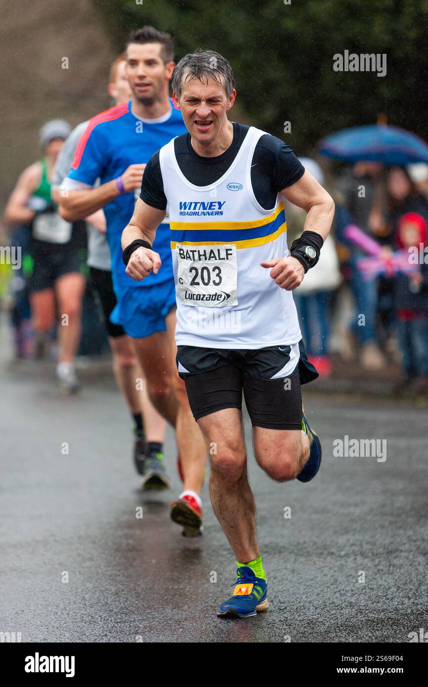 Male athletes running and competing in the Bath Half Marathon road race ...