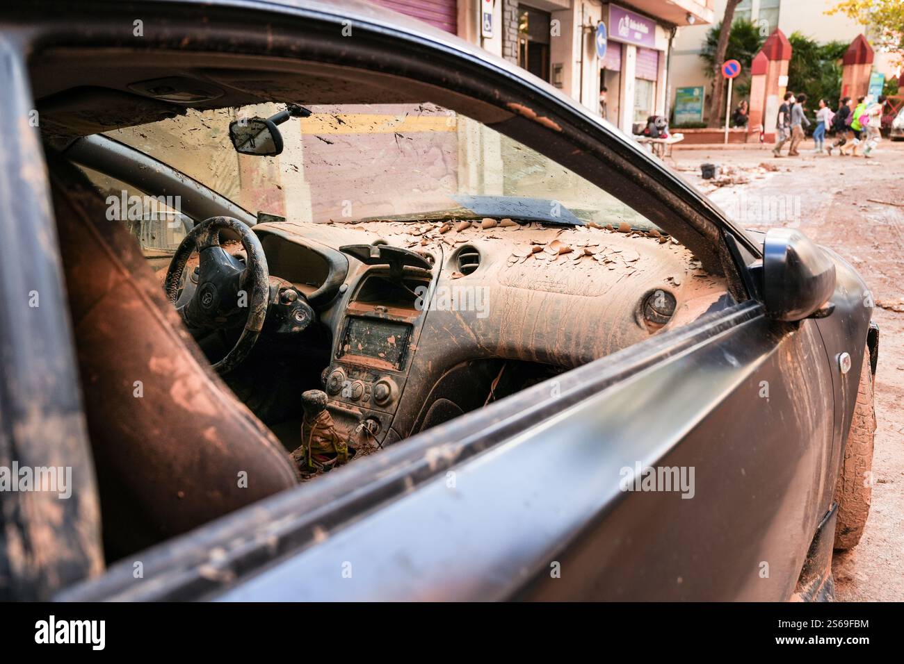 Car interior dashboard and steering wheel covered in mud in muddy ...