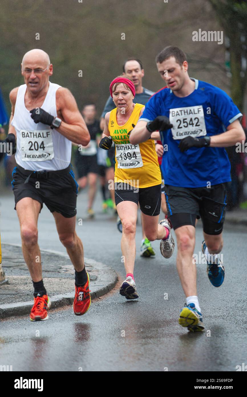 Male athletes running and competing in the Bath Half Marathon road race ...