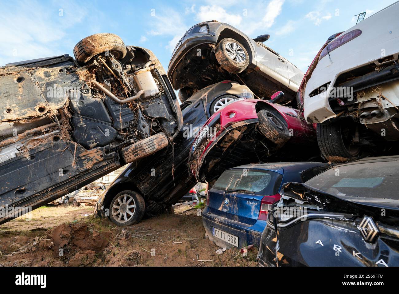 Damaged crushed cars piled up in car cemeteries in ground zero areas ...