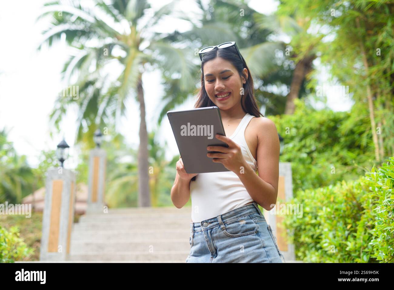 Beautiful woman using tablet device hi-res stock photography and images ...