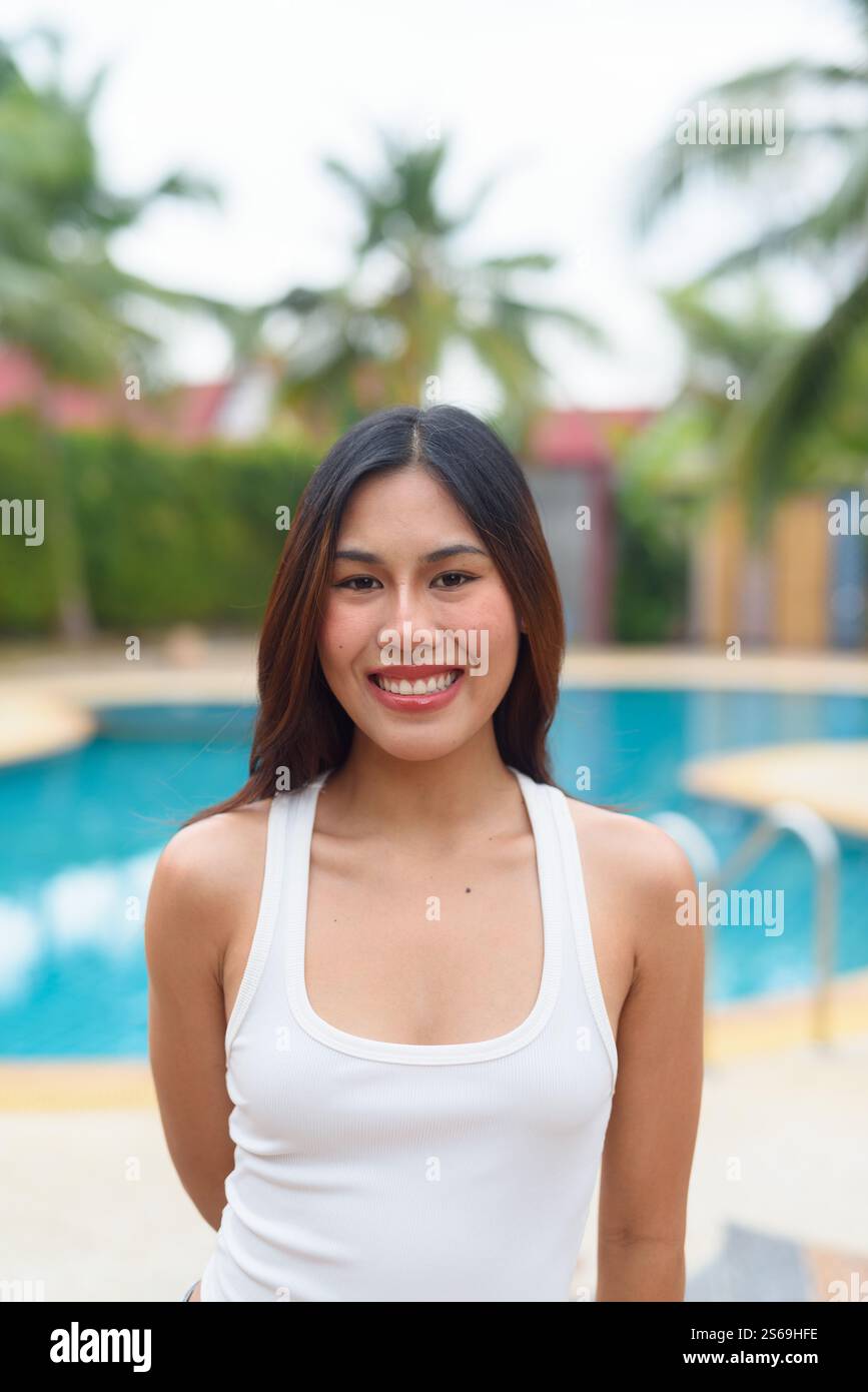 Young Asian woman swimming pool portrait Stock Photo - Alamy