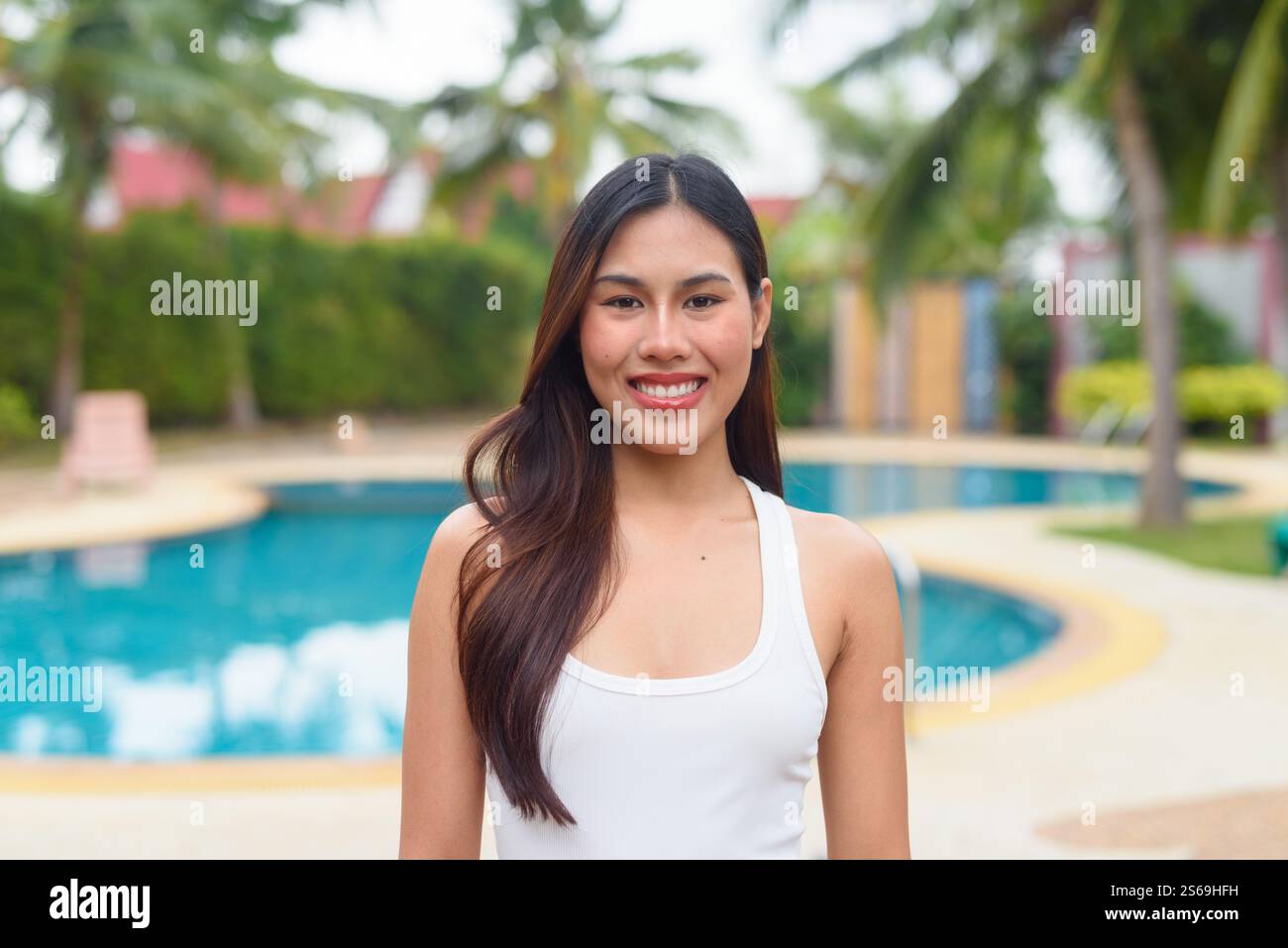 Young Asian woman swimming pool portrait Stock Photo - Alamy