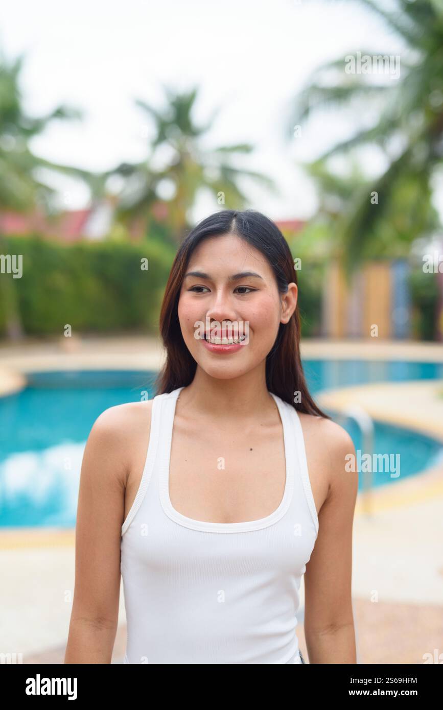 Young Asian woman swimming pool portrait Stock Photo - Alamy
