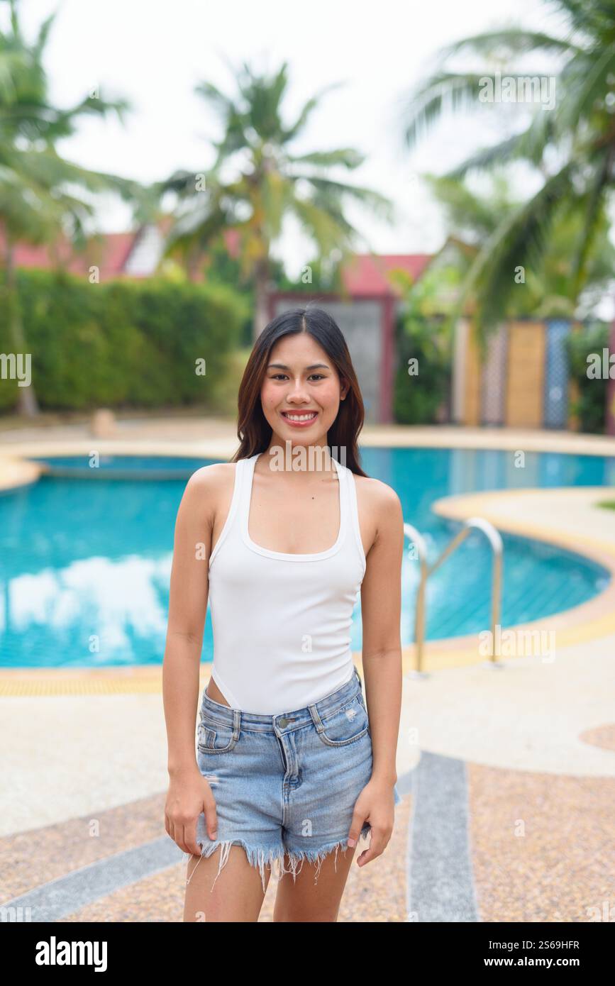 Young Asian woman swimming pool portrait Stock Photo - Alamy