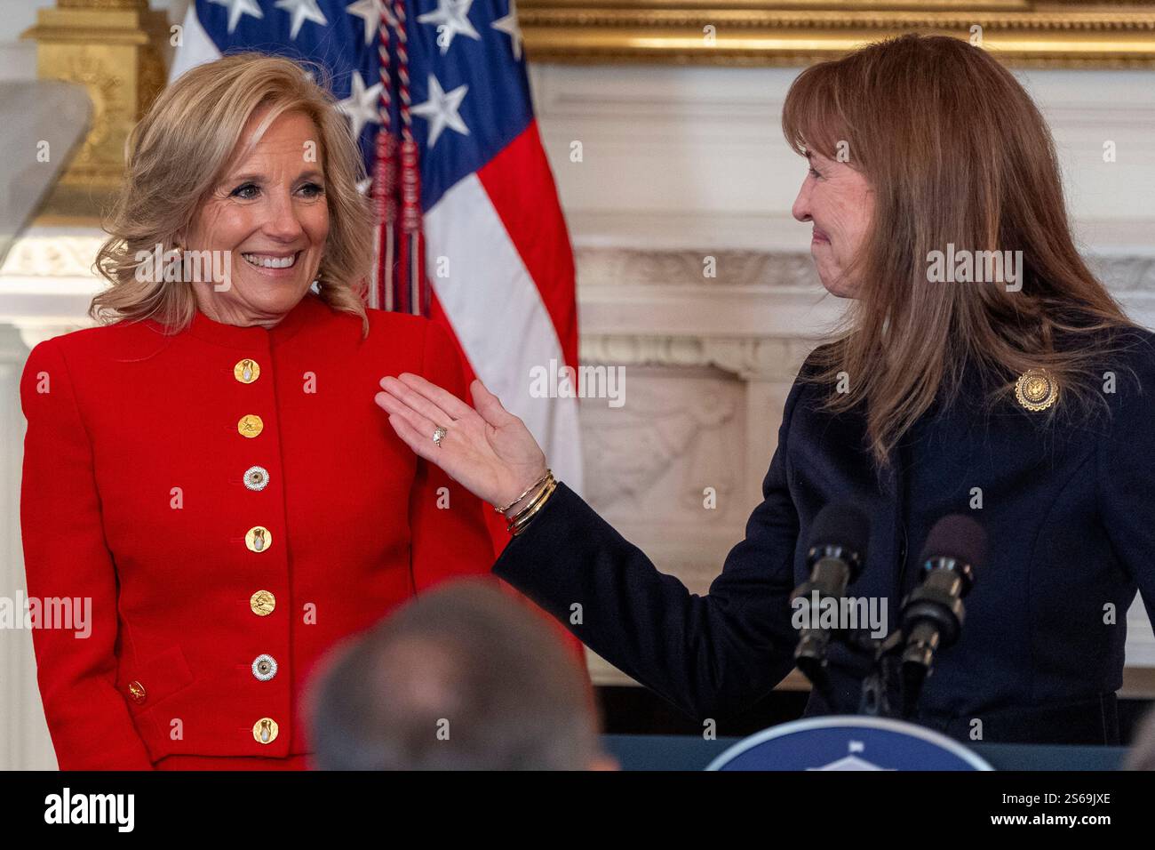 Sheila Casey, right, executive director of Joining Forces, gestures to ...