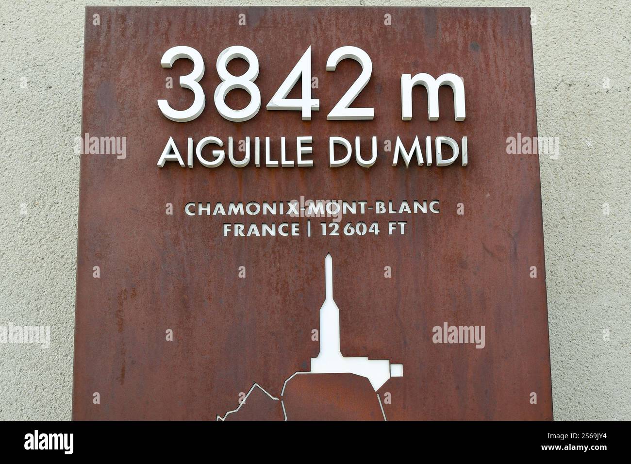 Close-up of the corten steel sign of the Aiguille du Midi cableway ...