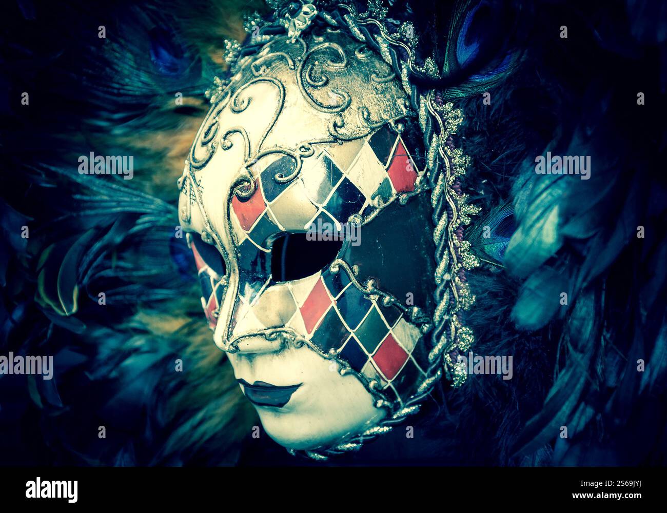 Venetian mysterious mask with plumage. Blue moody toned photo Stock ...
