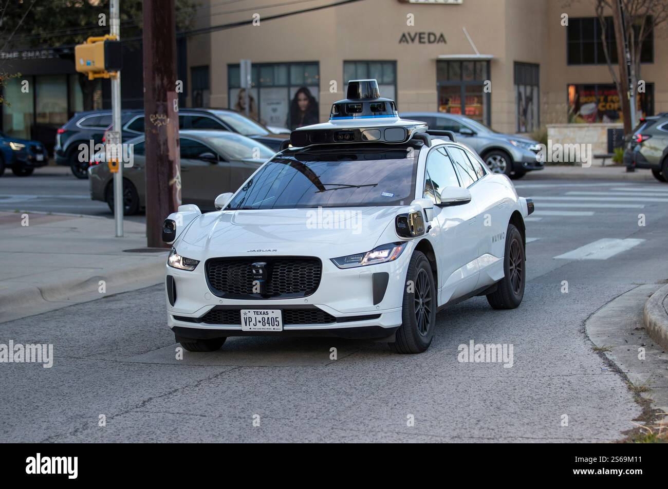 Waymo self-driving cars like this one are a common sight in the streets ...