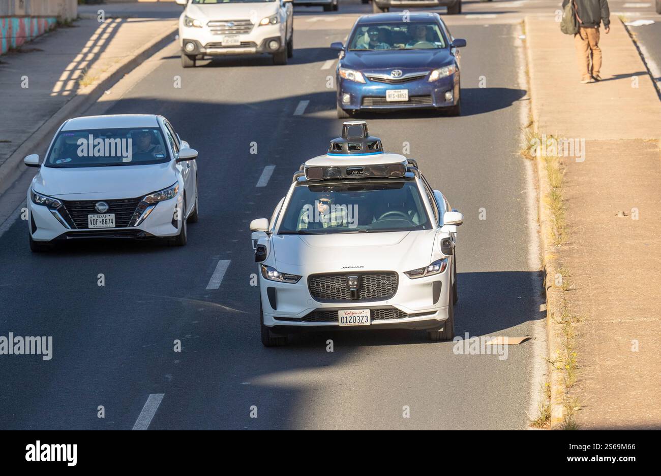 Waymo self-driving cars like this one are a common sight in the streets ...