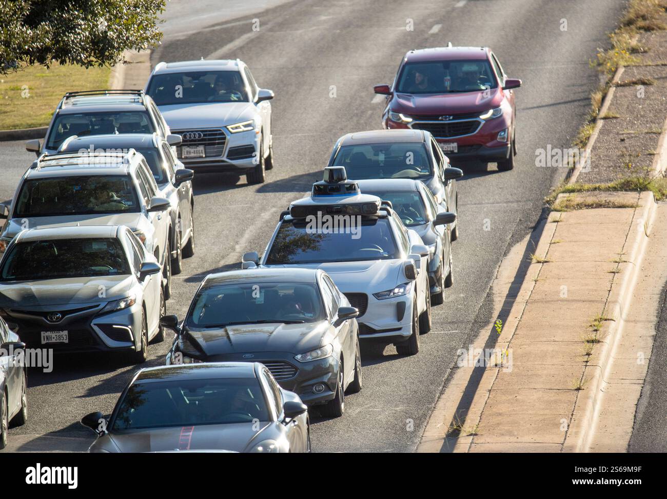 Waymo self-driving cars like this one are a common sight in the streets ...