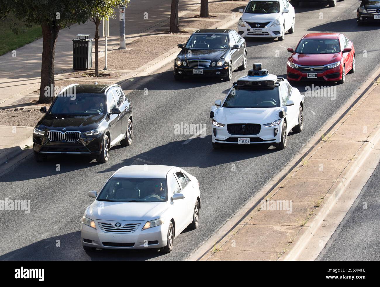 Waymo self-driving cars like this one are a common sight in the streets ...