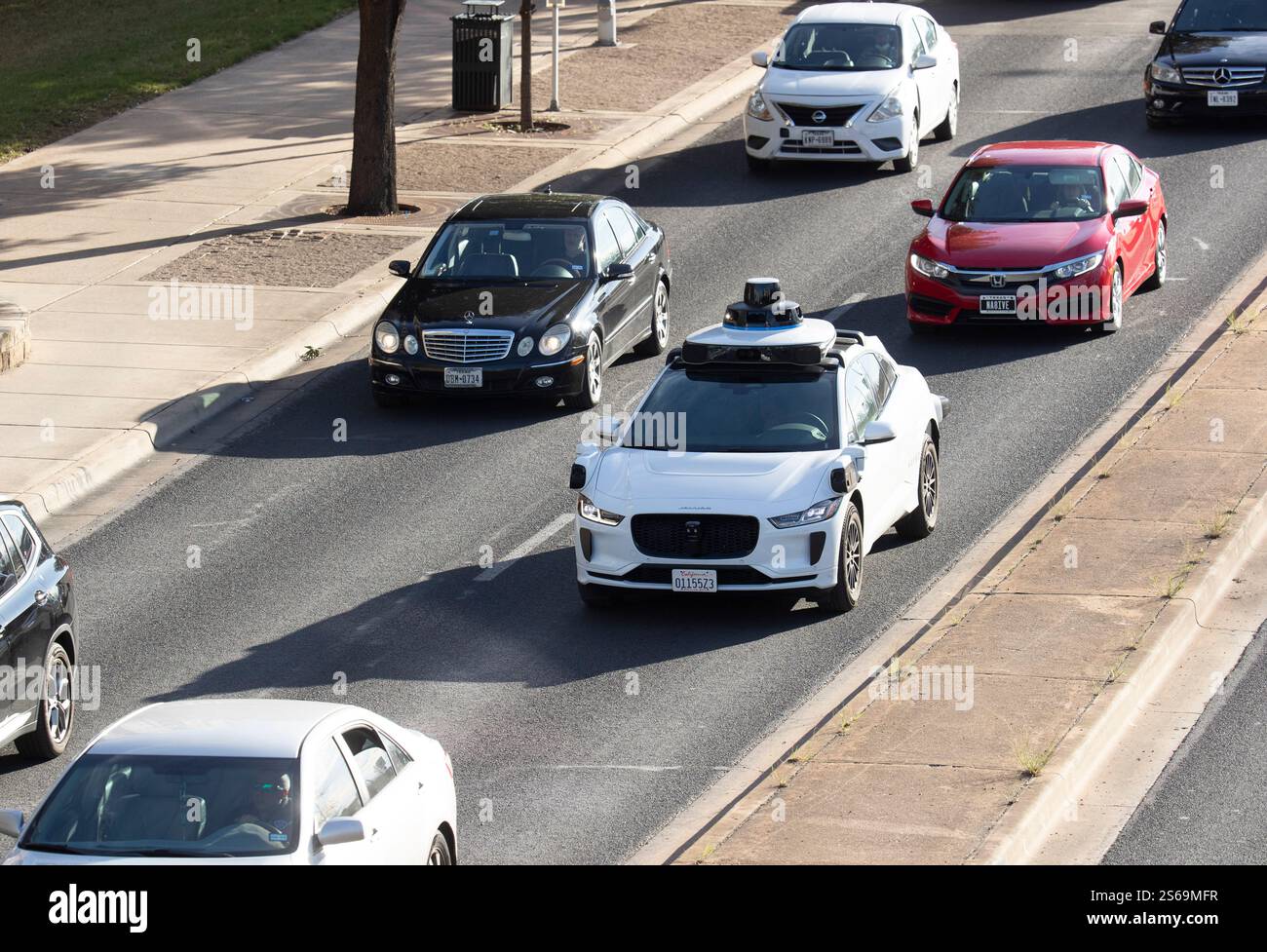 Waymo self-driving cars like this one are a common sight in the streets ...