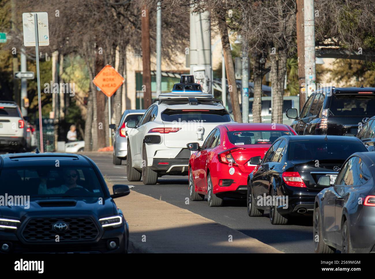 Waymo self-driving cars like this one are a common sight in the streets ...