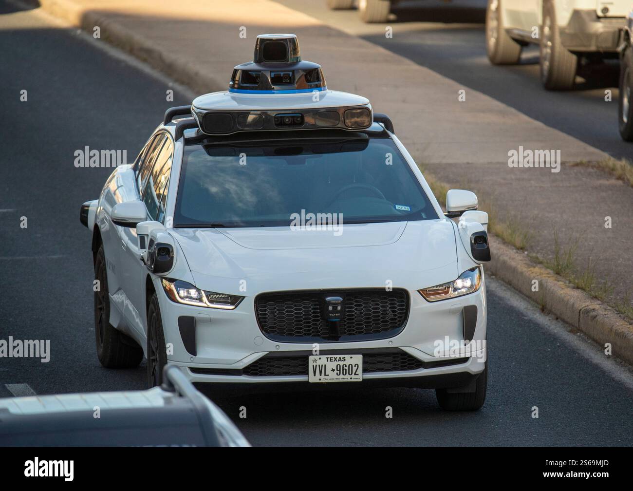 Waymo self-driving cars like this one are a common sight in the streets ...