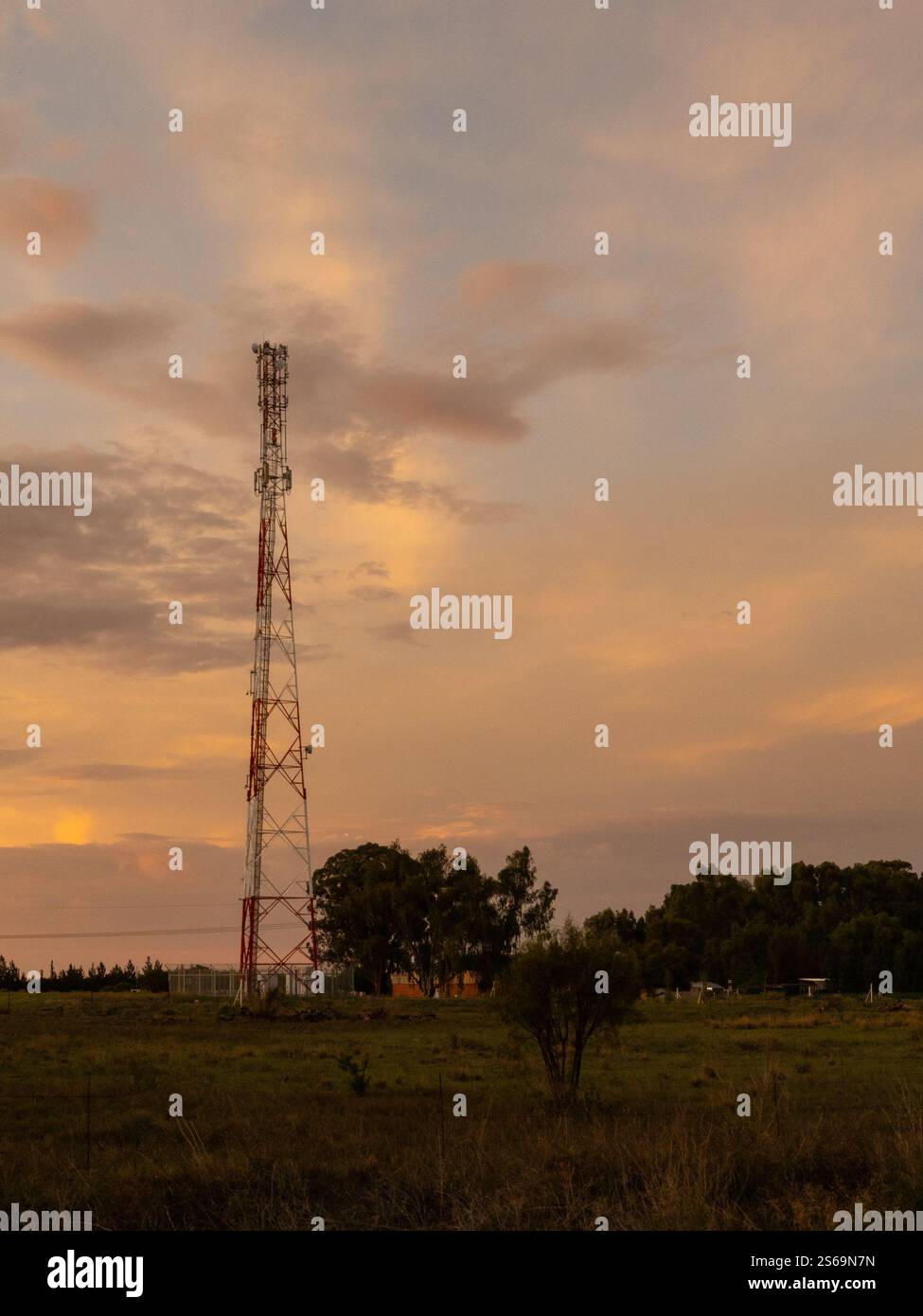 Cell tower on farm land, sunset scene Stock Photo - Alamy