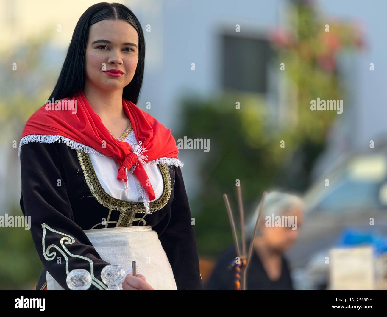 Festival of Cretan Cuisine - A beautiful young woman with black hair is ...