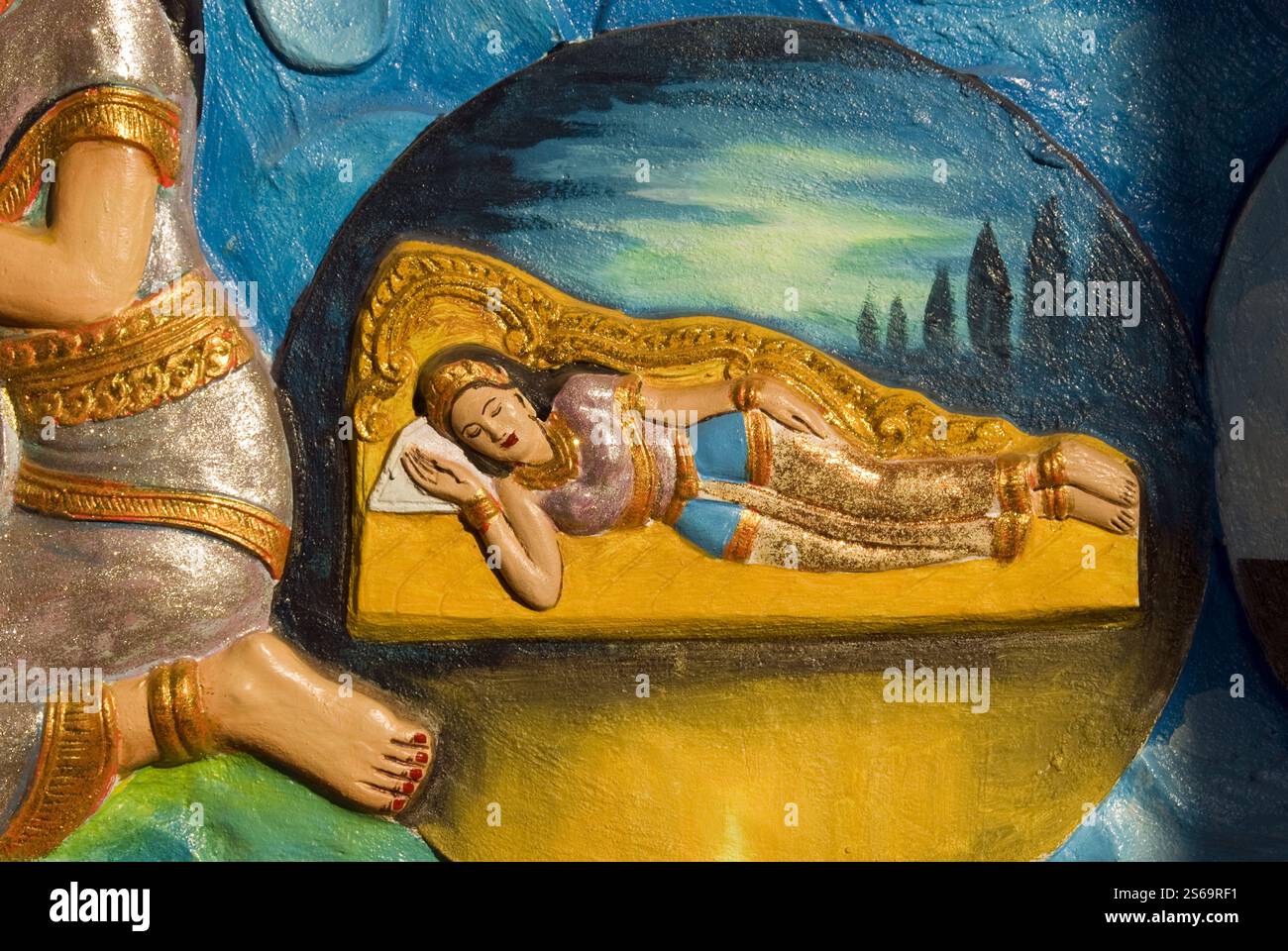 Painted reliefs of scenes of the Buddha's life decorate walls at Wat ...