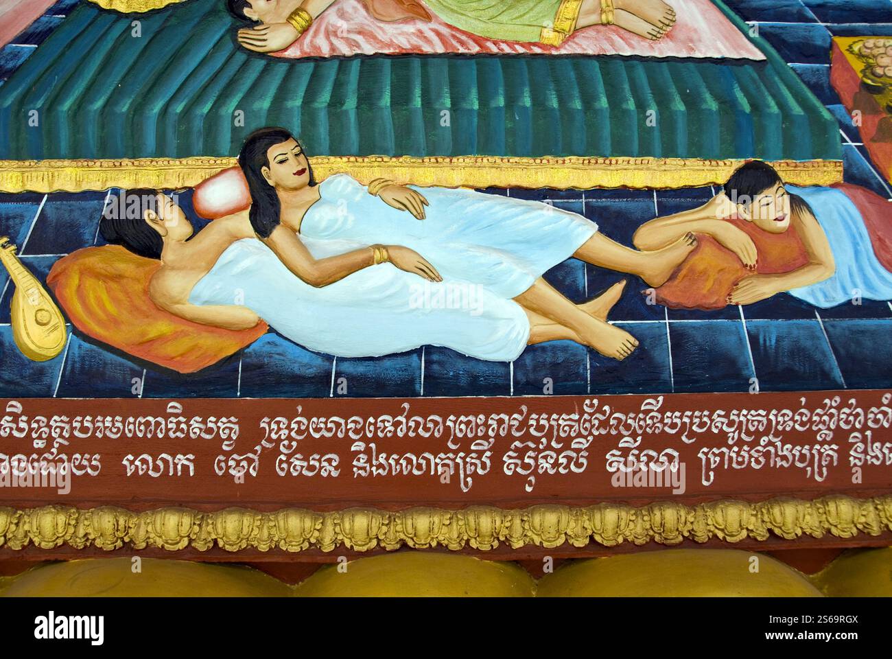 Painted reliefs of scenes of the Buddha's life decorate walls at Wat ...
