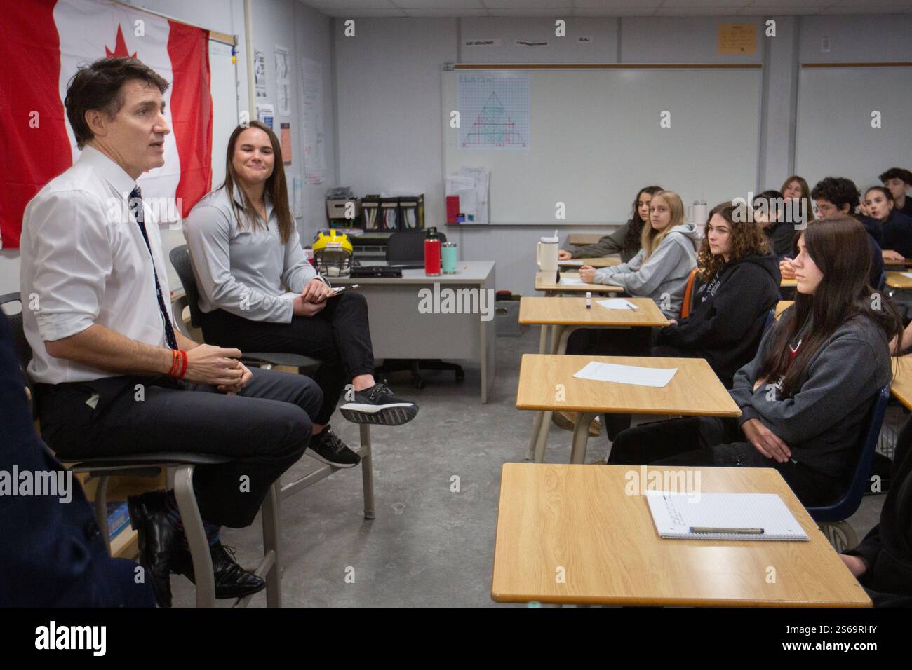Prime Minister Justin Trudeau visits with teacher Linda Morais and her ...