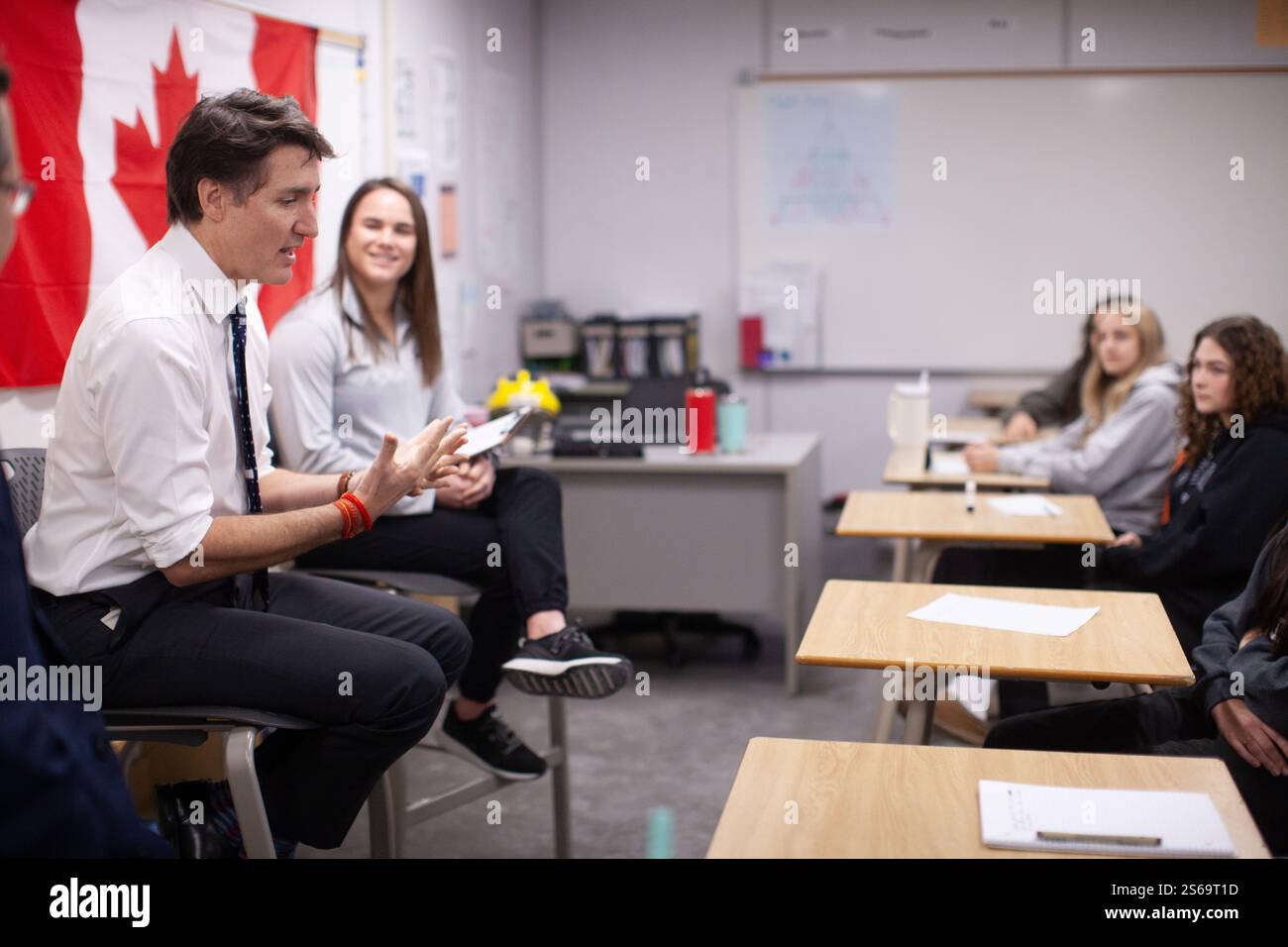 Prime Minister Justin Trudeau, left, visits with teacher Linda Morais ...