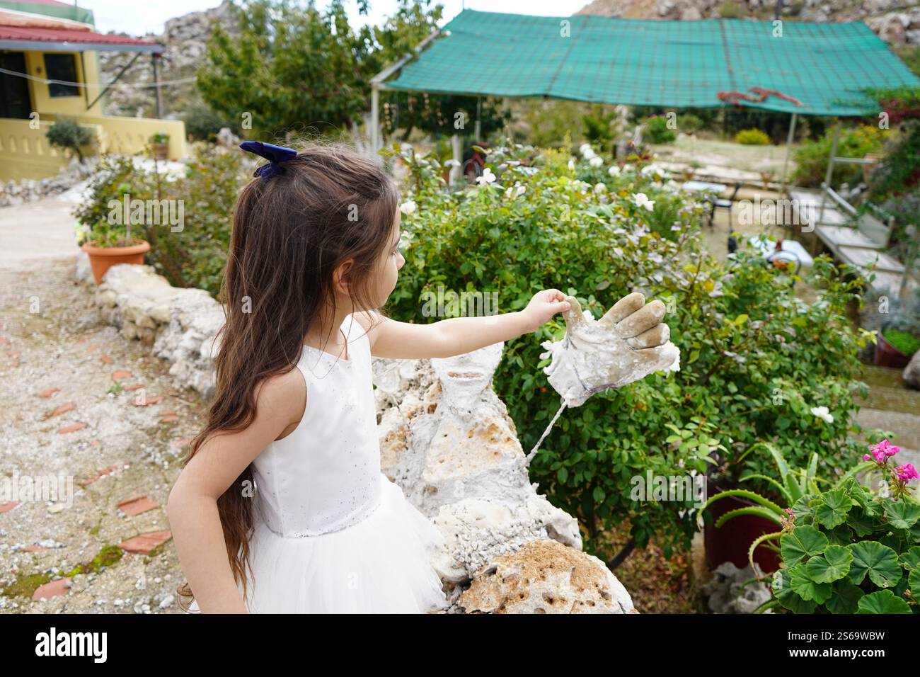 An adorable five years old little girl from Greece with very long hair ...