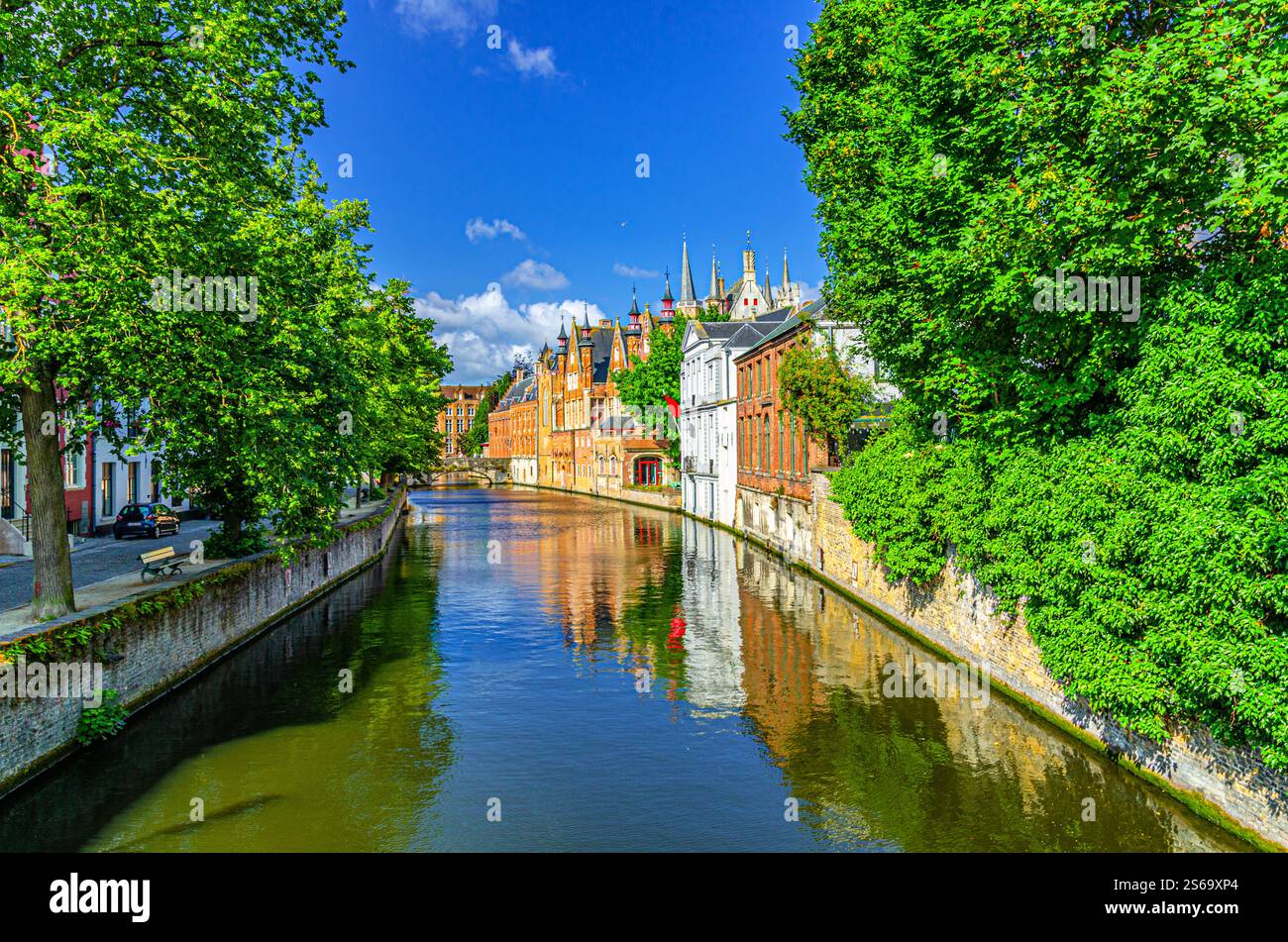 Bruges cityscape, green trees on promenade embankment of Groenerei ...