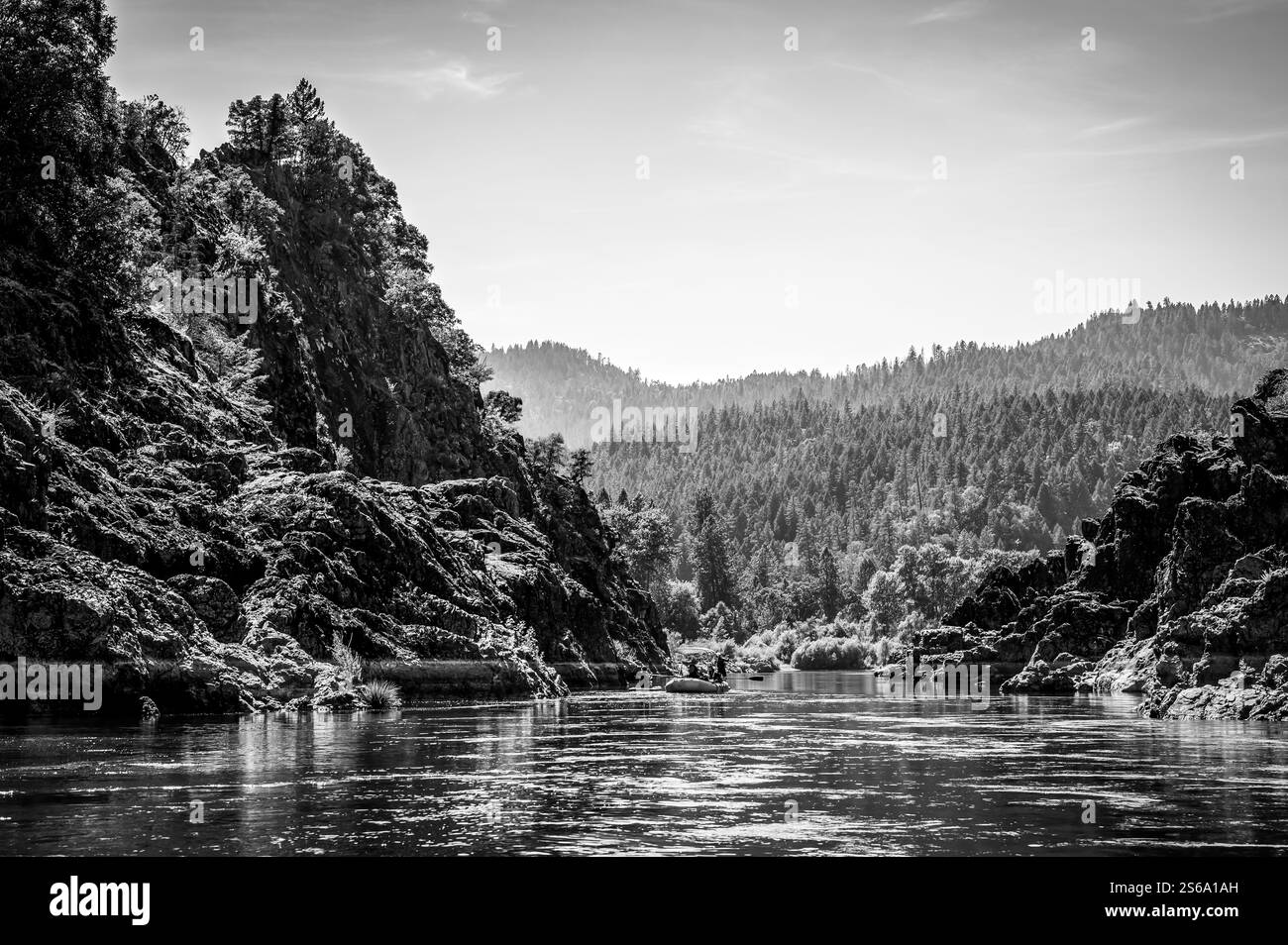 Wild and scenic Rogue River in Southern Oregon with a distant rafter ...