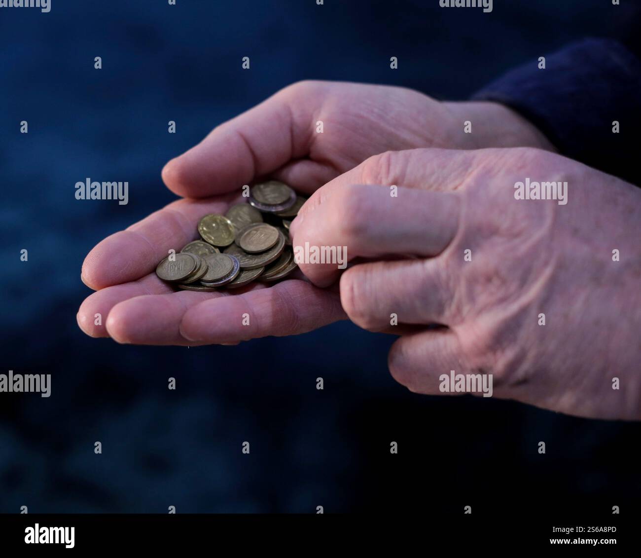 Old person counting coins hi-res stock photography and images - Alamy