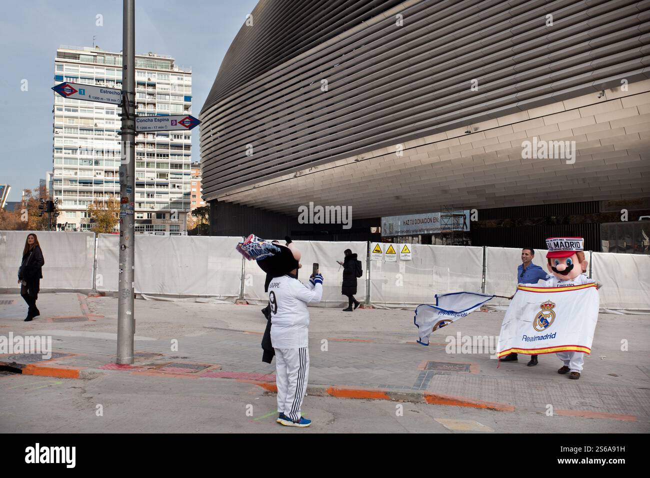People outside Real Madrid's new Santiago Bernabéu stadium in Madrid ...