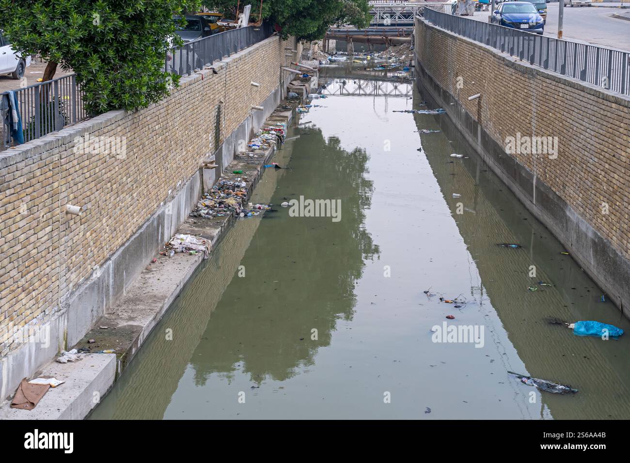 Sewage canal clogged by floating waste in Basrah, Iraq Stock Photo - Alamy