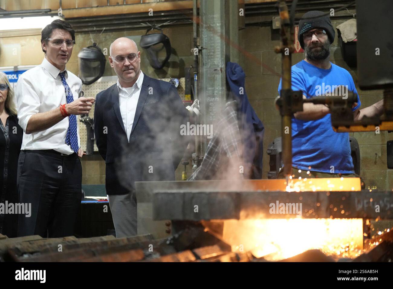 Canada Prime Minister Justin Trudeau speaks with management and workers ...
