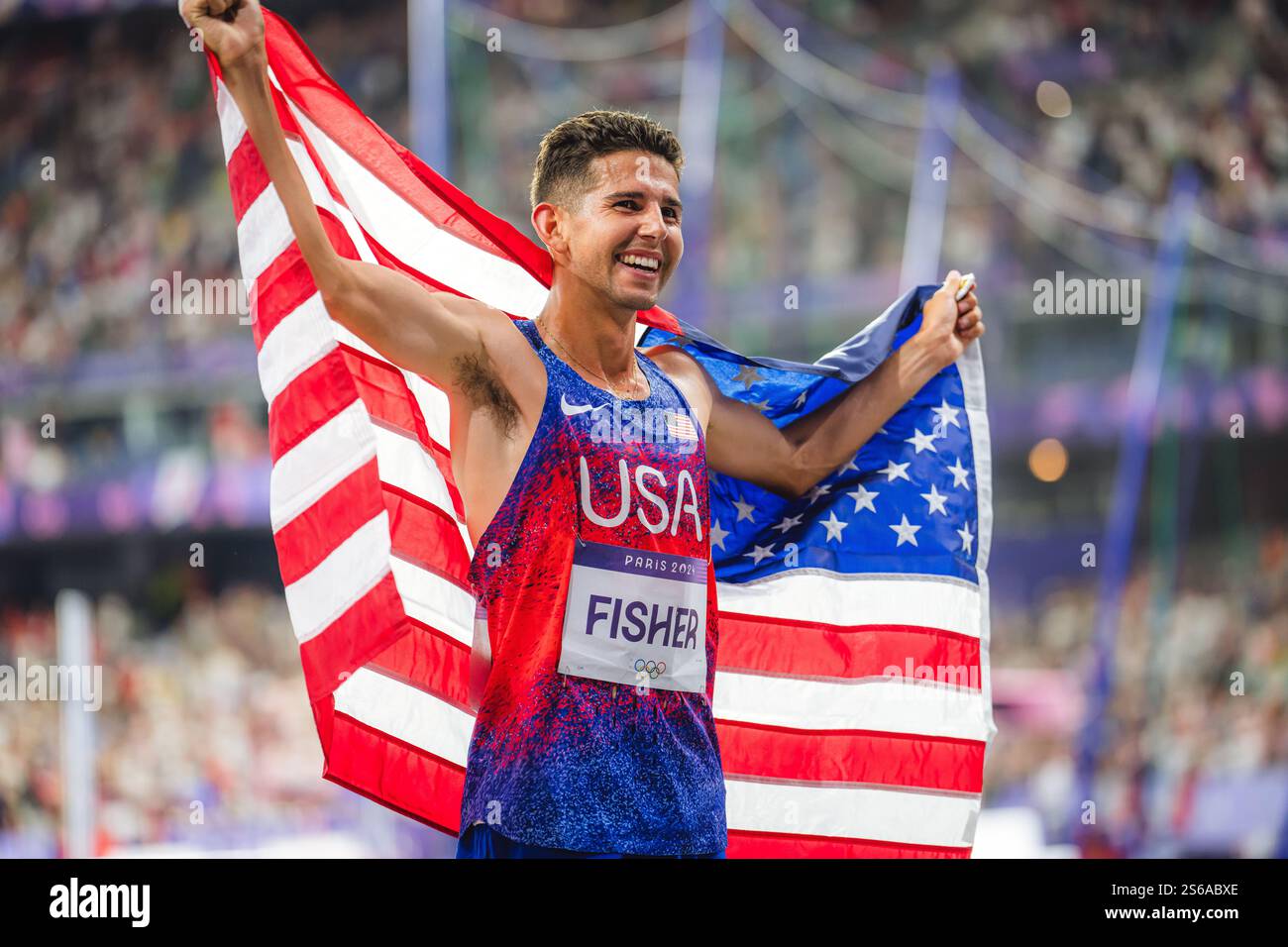 Grant Fisher celebrating her medal with her country's flag at the Paris ...